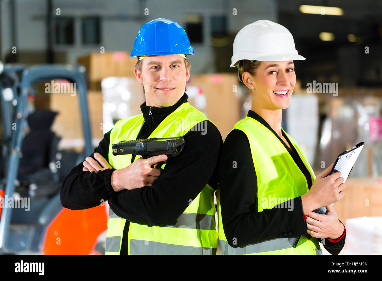 forklift driver and colleague,in storage of freight forwarding Stock ...