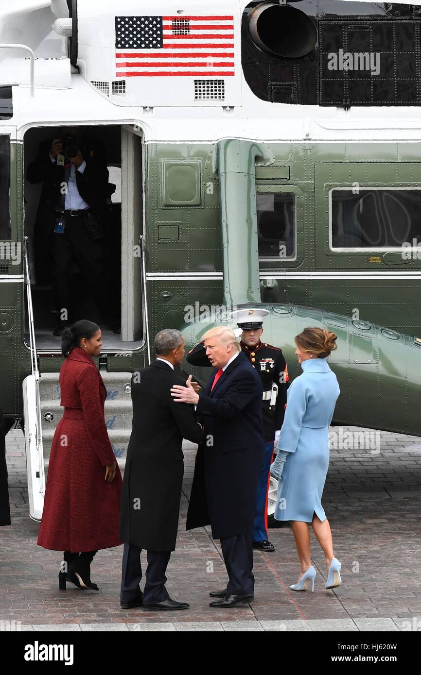 Former United States President Barack Obama and Michelle Obama stand ...