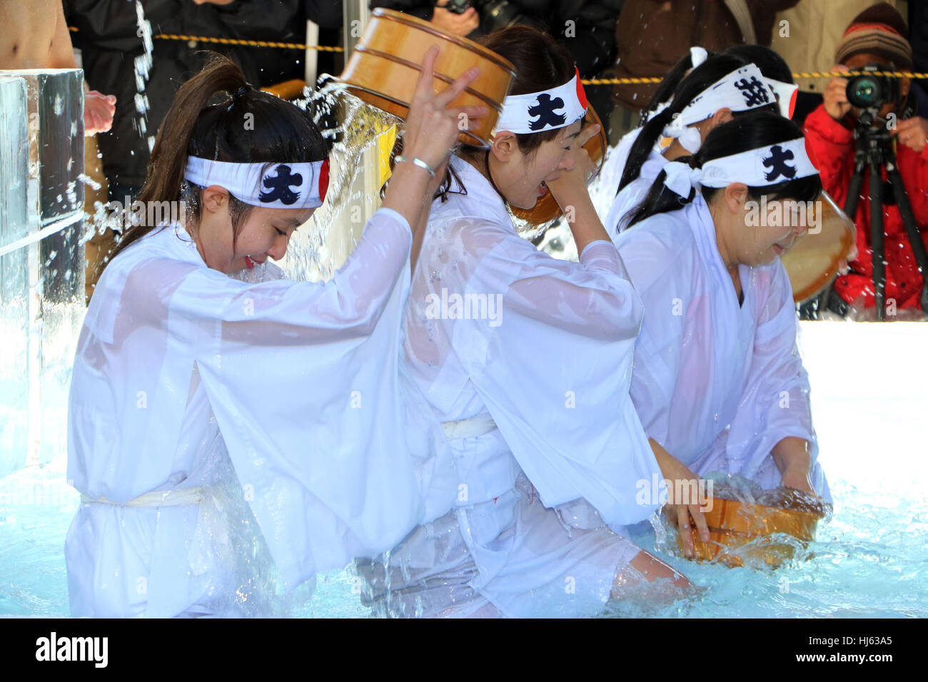 Tokyo, Japan. 21st Jan, 2017. Shinto believers pour cold water over ...
