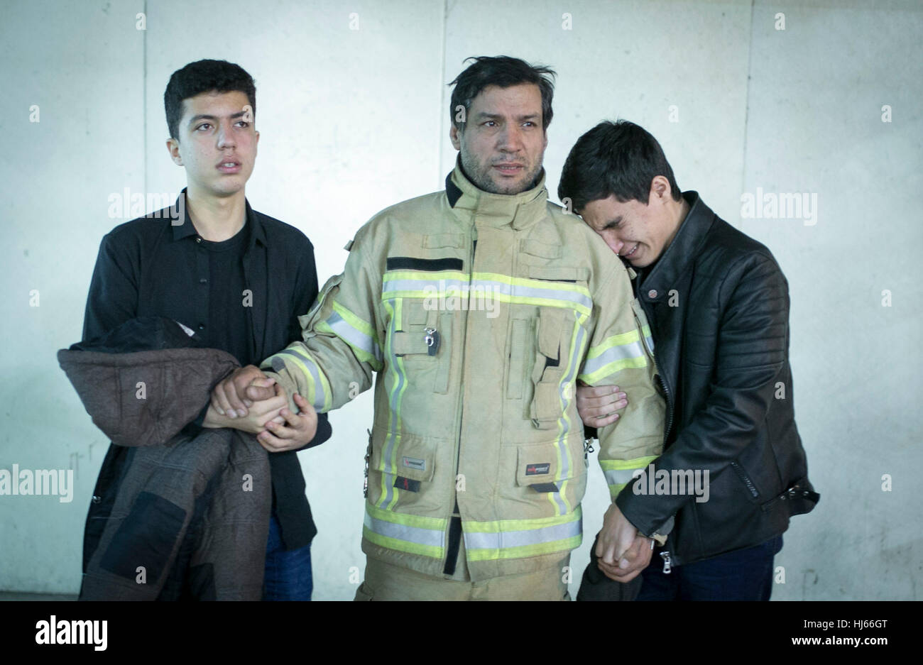 Tehran, Iran. 25th Jan, 2017. An Iranian firefighter (C) and his sons ...