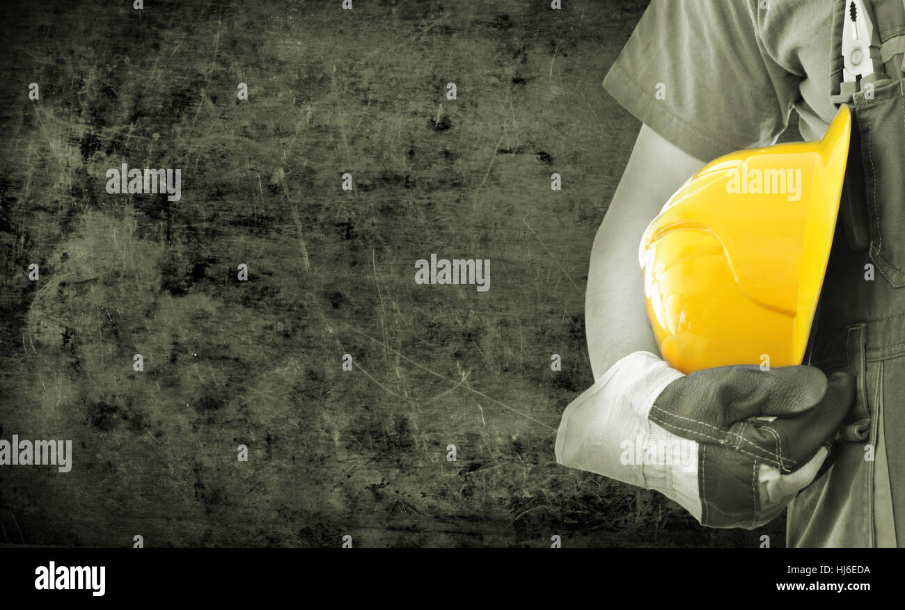 worker and grunge texture in background Stock Photo - Alamy