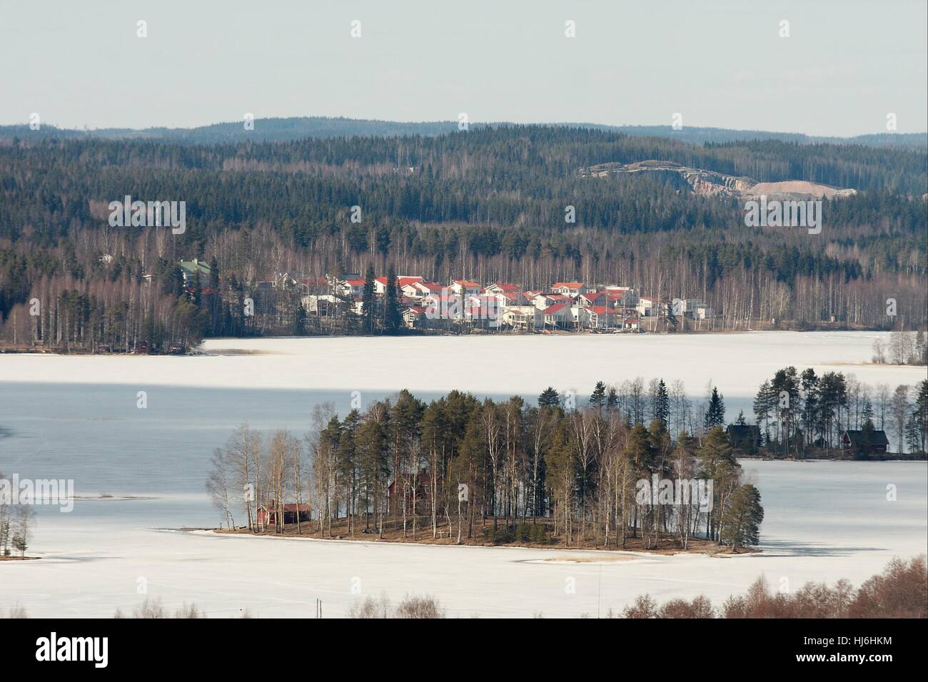 Landscape in Finland with hills and frozen lake Stock Photo - Alamy