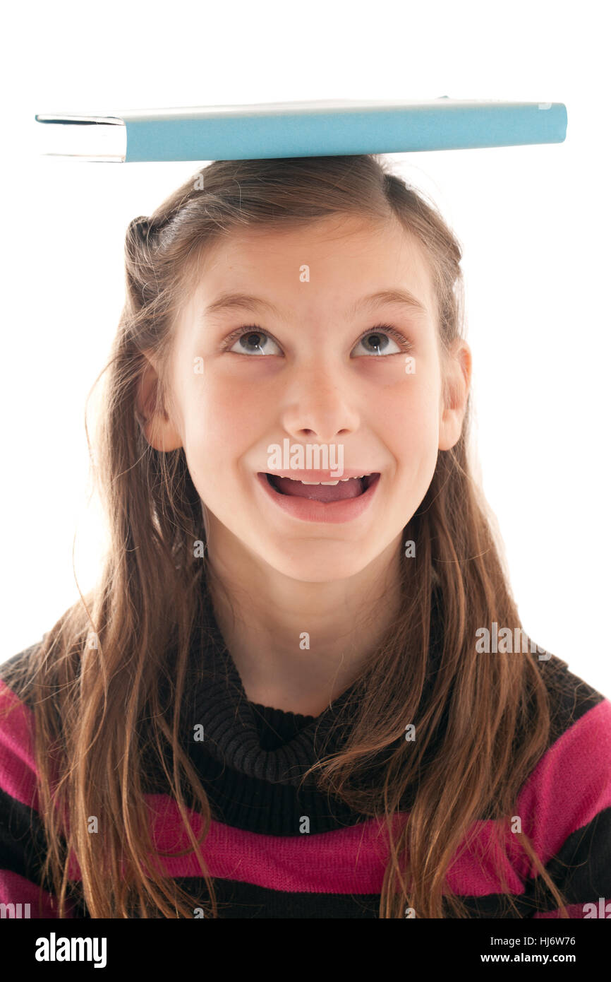 girl with book on her head Stock Photo - Alamy