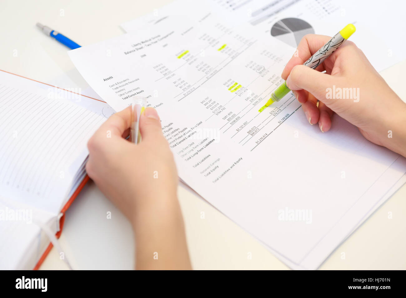 Young girl working with papers Stock Photo - Alamy