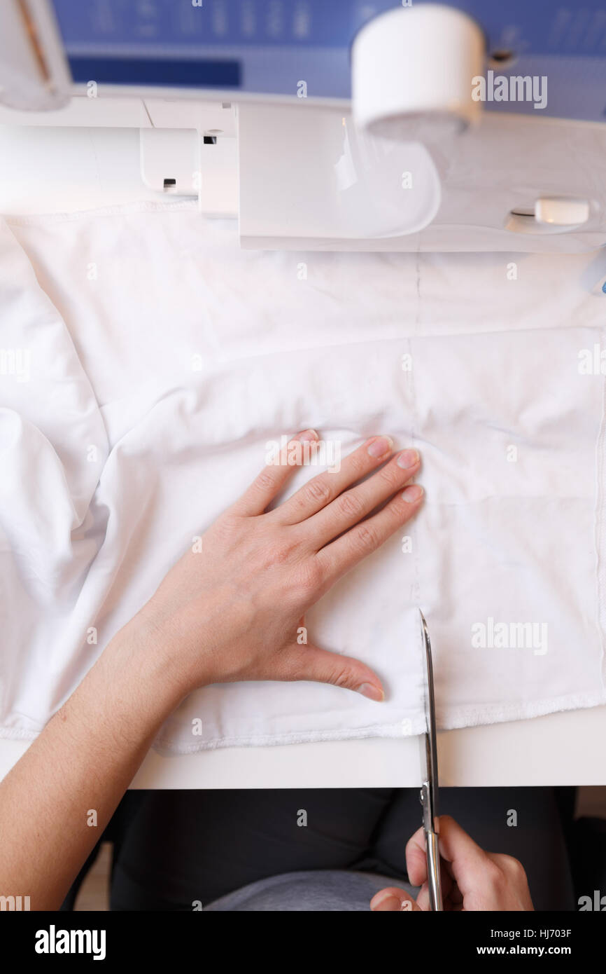 Woman with scissors cuts pattern Stock Photo - Alamy
