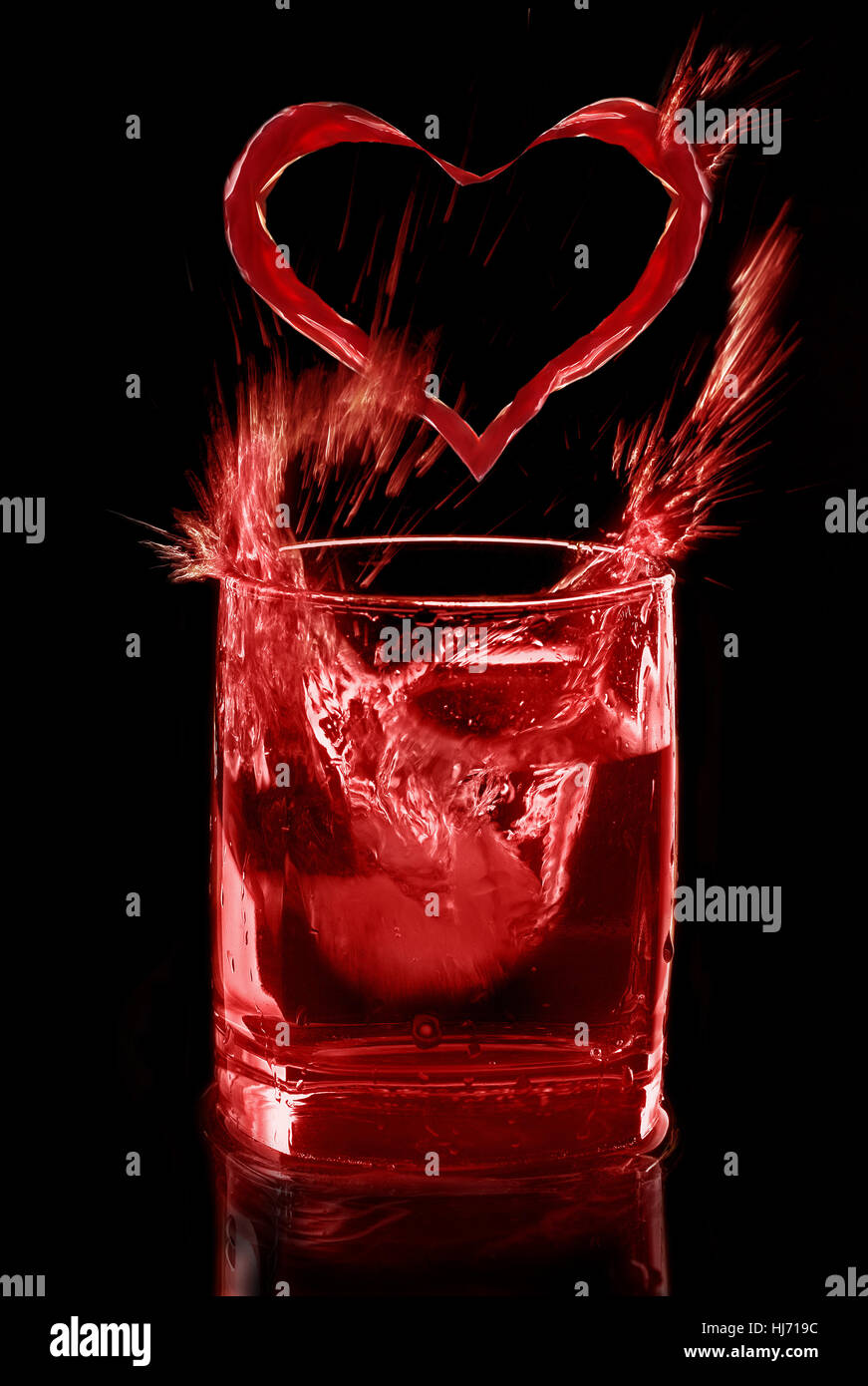 The drink of love on black background, splash and heart Stock Photo - Alamy