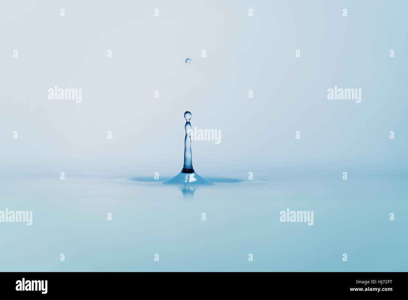 clear blue water drop with ripple on surface Stock Photo - Alamy