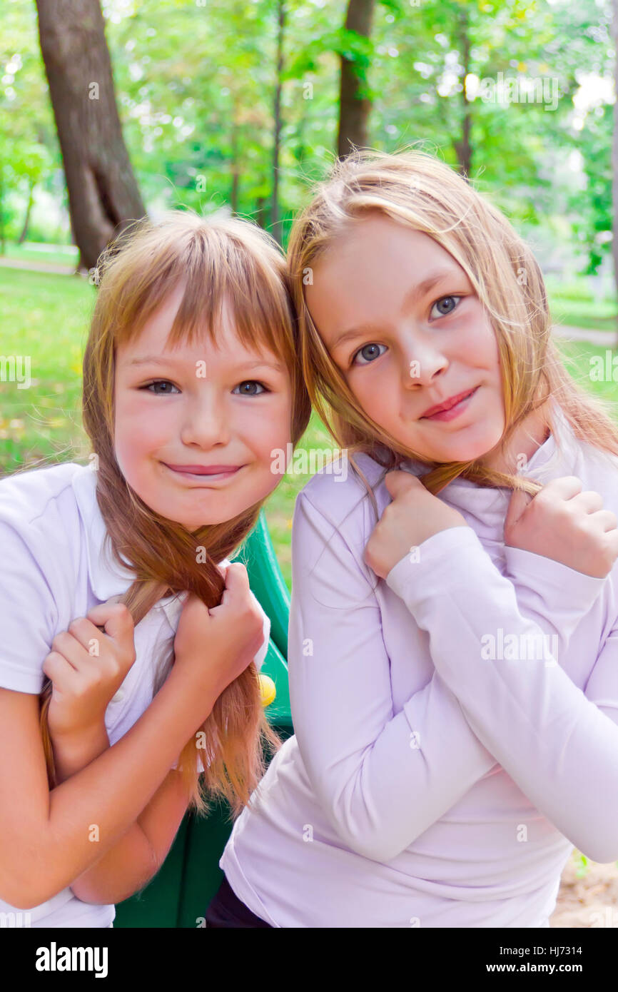 Photo of two playing girls in summer Stock Photo - Alamy