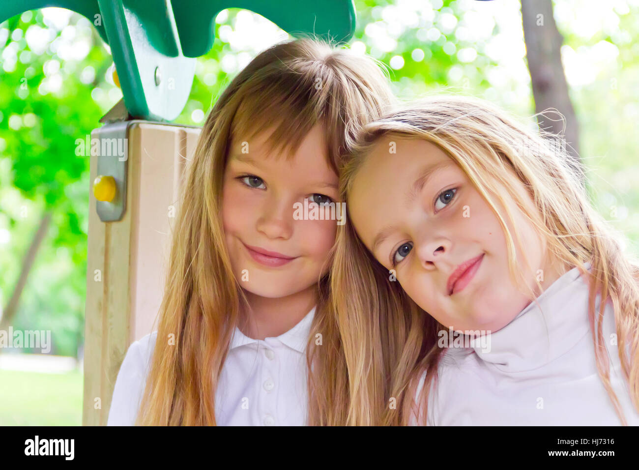 Photo of two cute girls with long hairs Stock Photo - Alamy