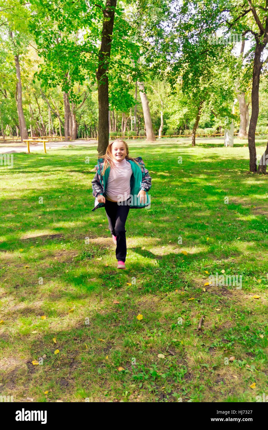 Photo of cute running girl in summer Stock Photo - Alamy