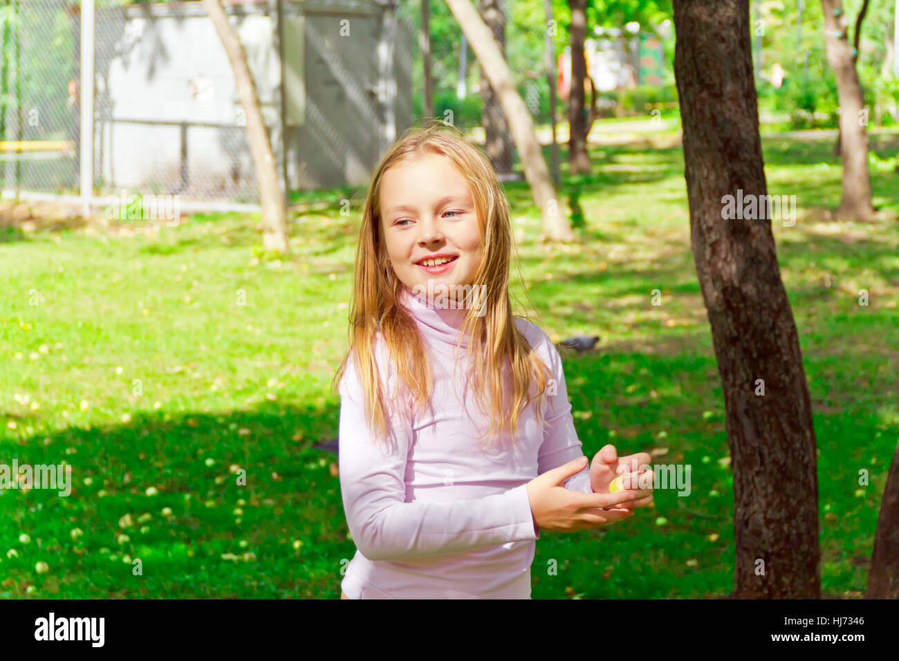 Photo of cute playing girl in summer Stock Photo - Alamy