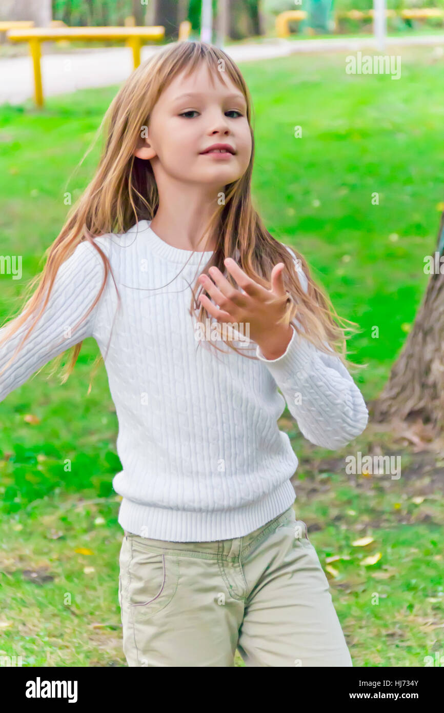 Photo of cute playing girl in summer Stock Photo - Alamy