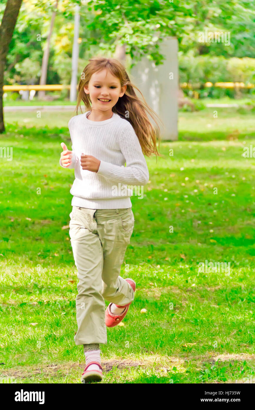 Photo of cute running girl in summer Stock Photo - Alamy