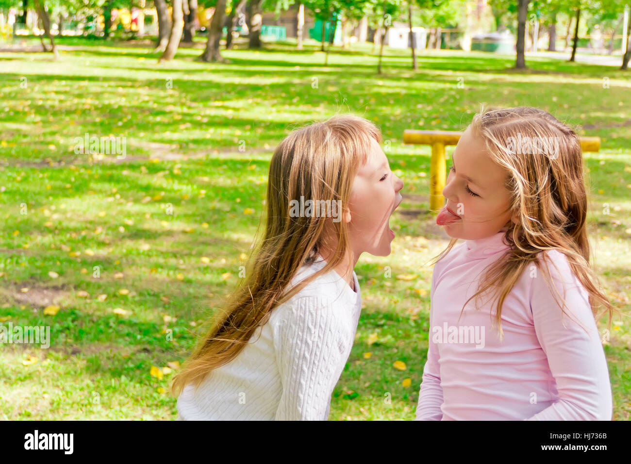 Two girls playing in play hi-res stock photography and images - Alamy