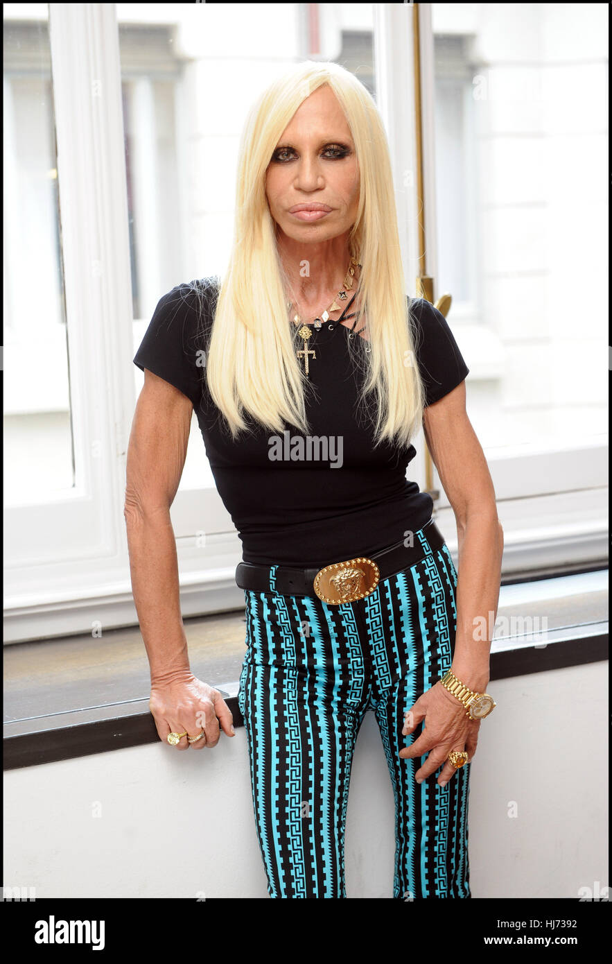 Fashion Designer Donatella Versace poses for photos in Milan Featuring ...