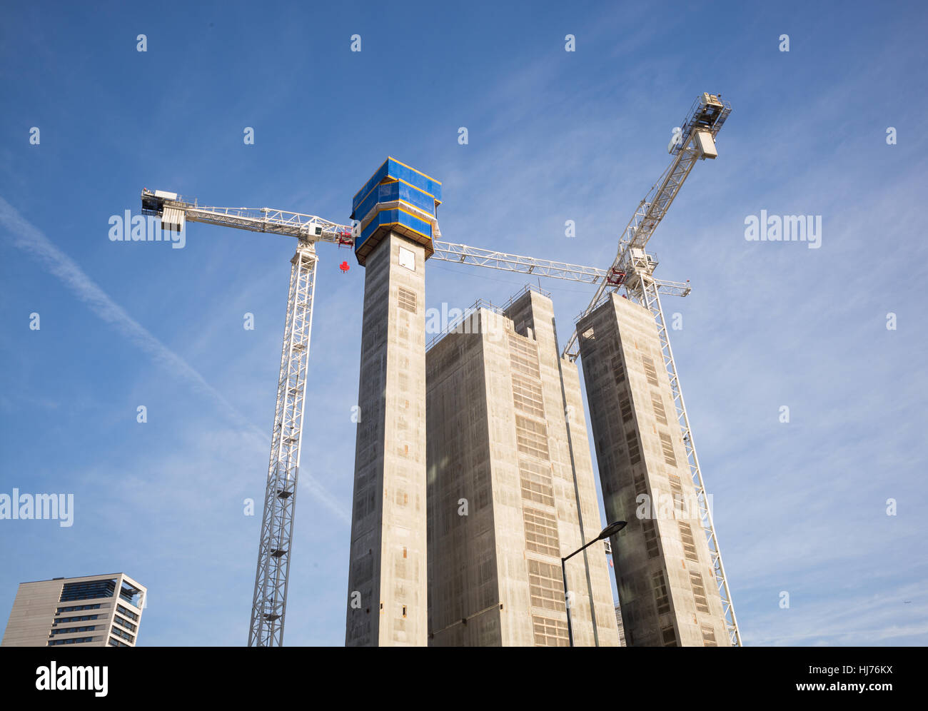 Cranes and core concrete shafts for apartment blocks under construction ...
