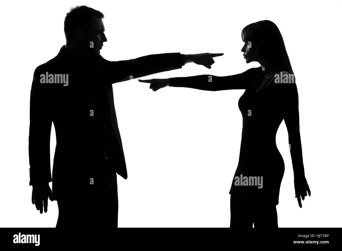one caucasian couple man and woman pointing at each other expressing ...