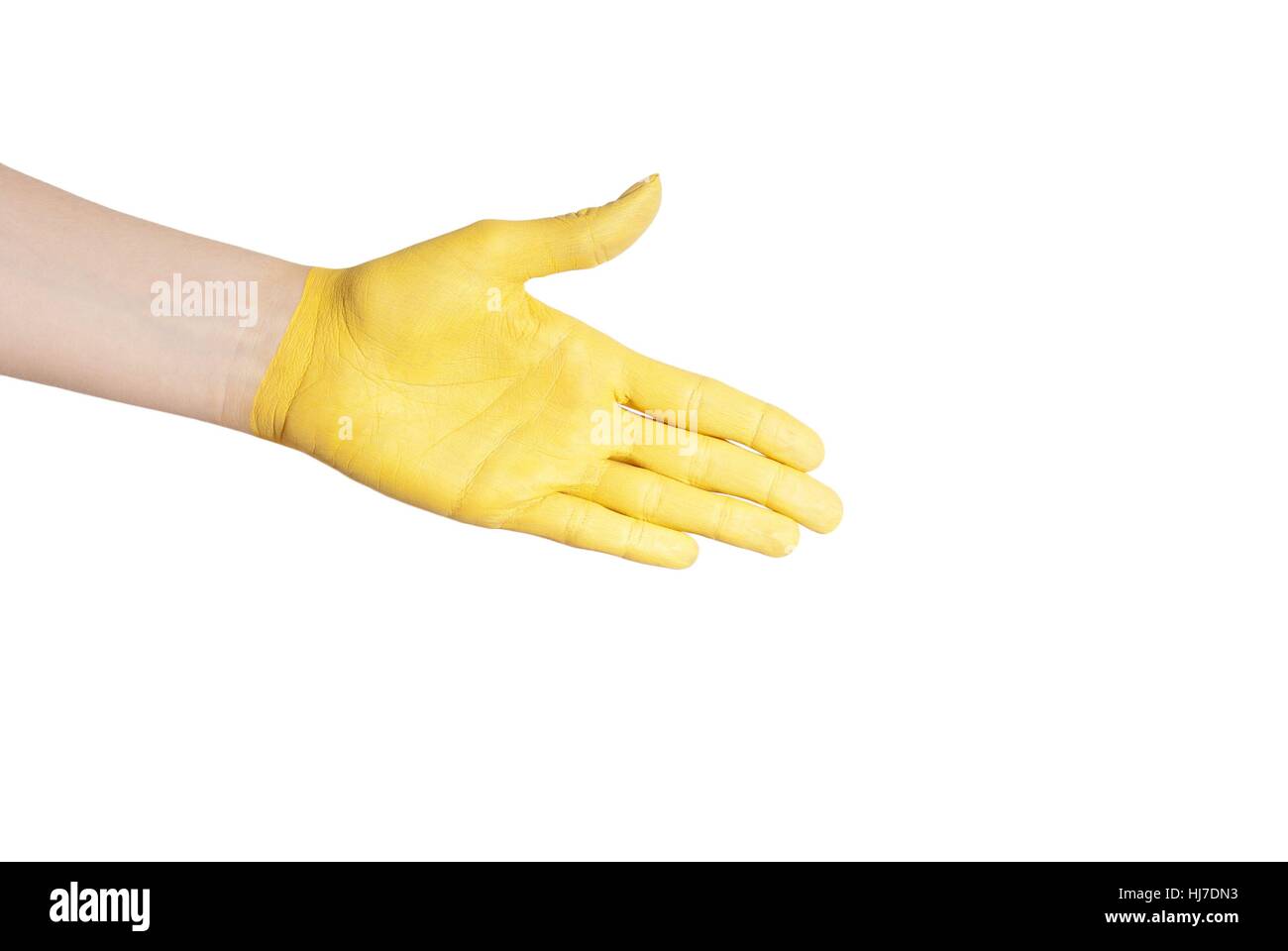 a yellow painted hand in handshake gesture Stock Photo - Alamy