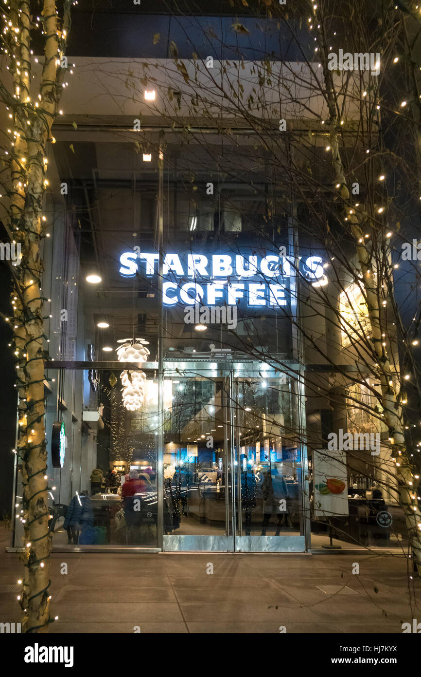 A Starbucks coffee house at night in Midtown Manhattan Stock Photo - Alamy