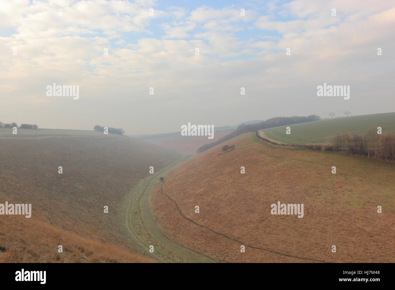 English winter landscape with clouds over the frosted valleys and ...