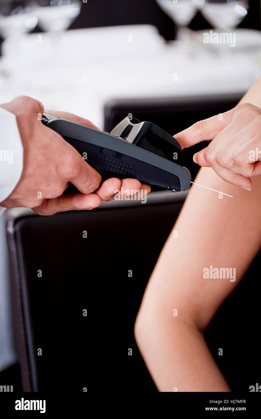 ec card payments in the restaurant with his wife and husband Stock ...