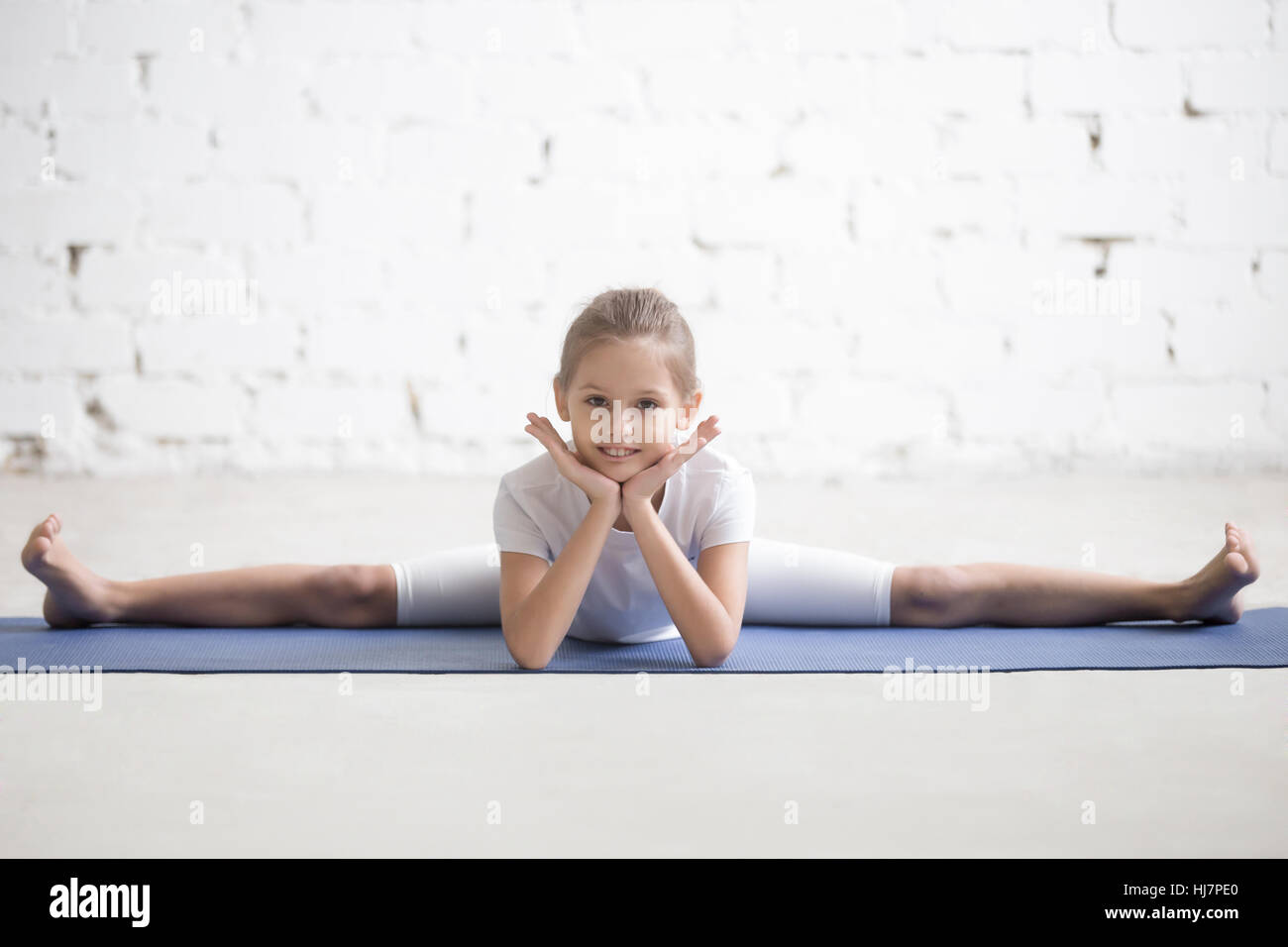 Girl child in Straight Angle pose, white studio background Stock Photo ...