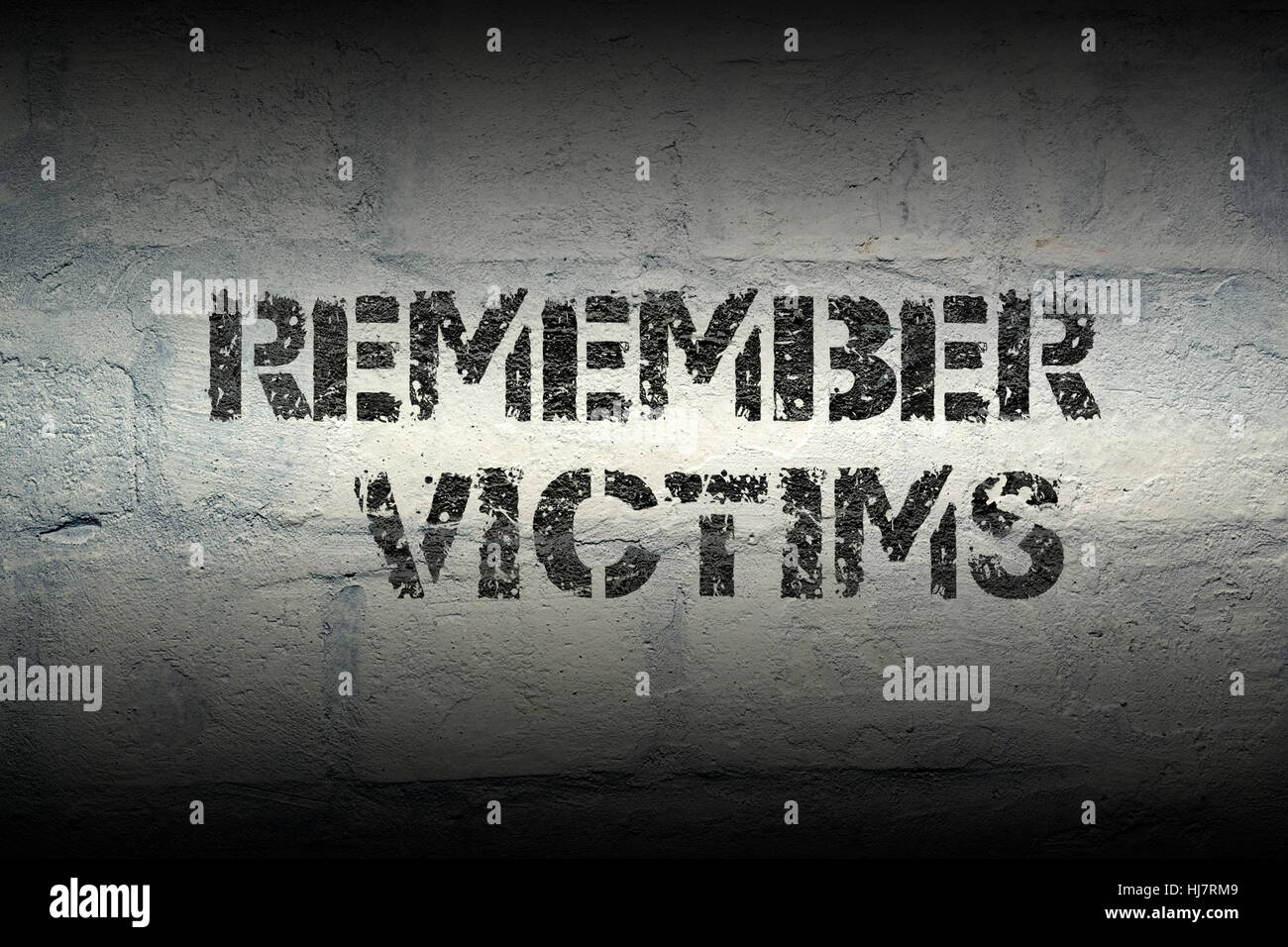 remember victims stencil print on the grunge white brick wall Stock ...