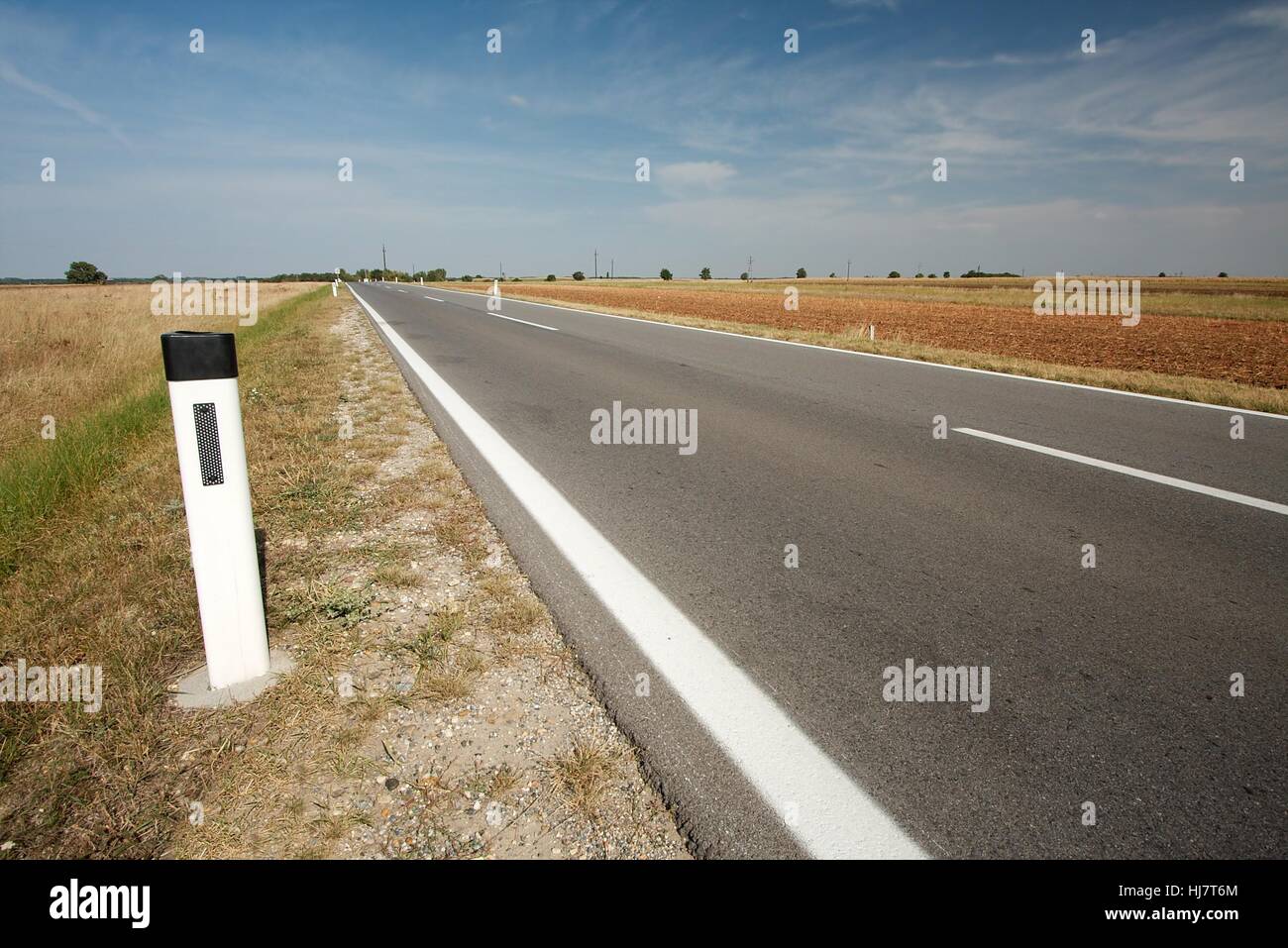 Road going straight through the countryside Stock Photo - Alamy