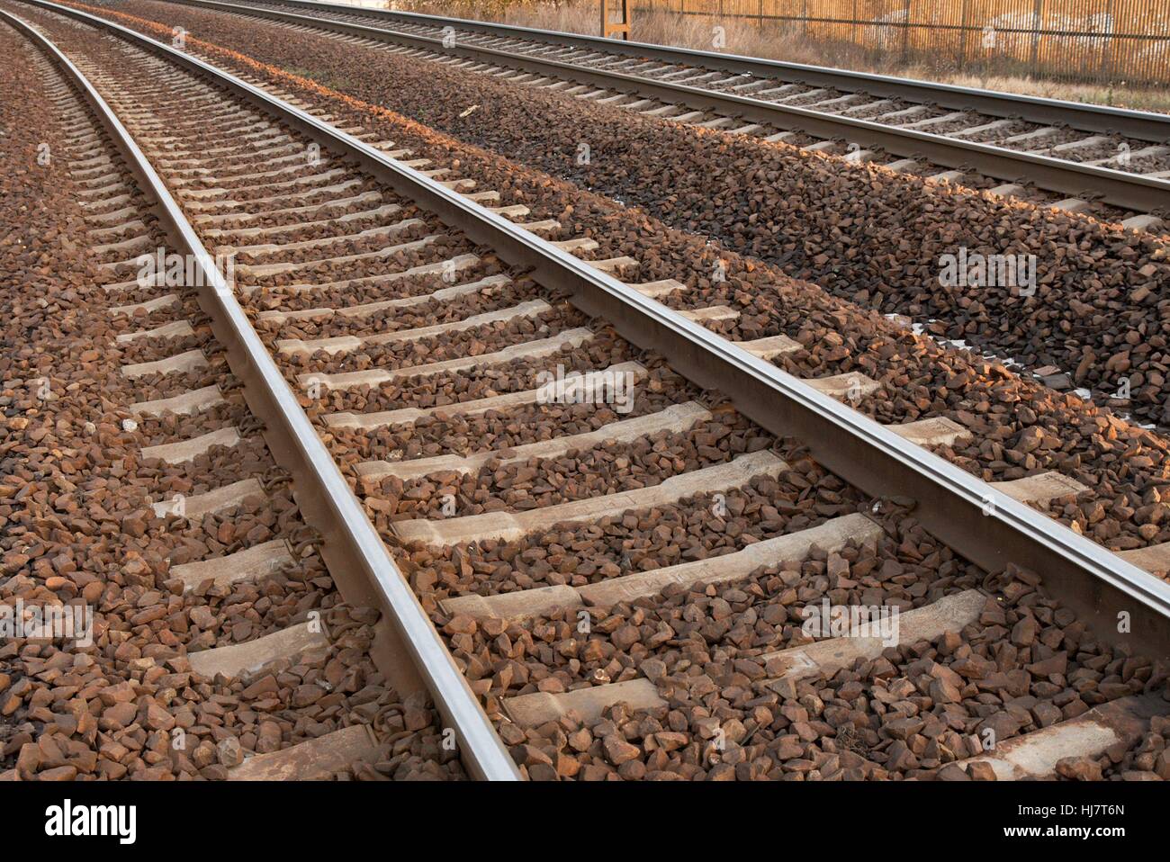 Two railway tracks in a bend Stock Photo - Alamy