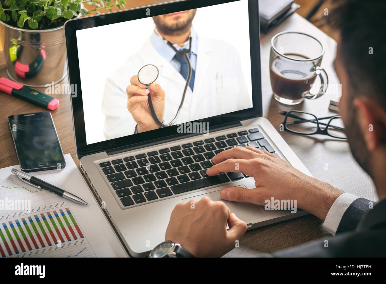 Doctor on a computer screen in an office environment Stock Photo - Alamy