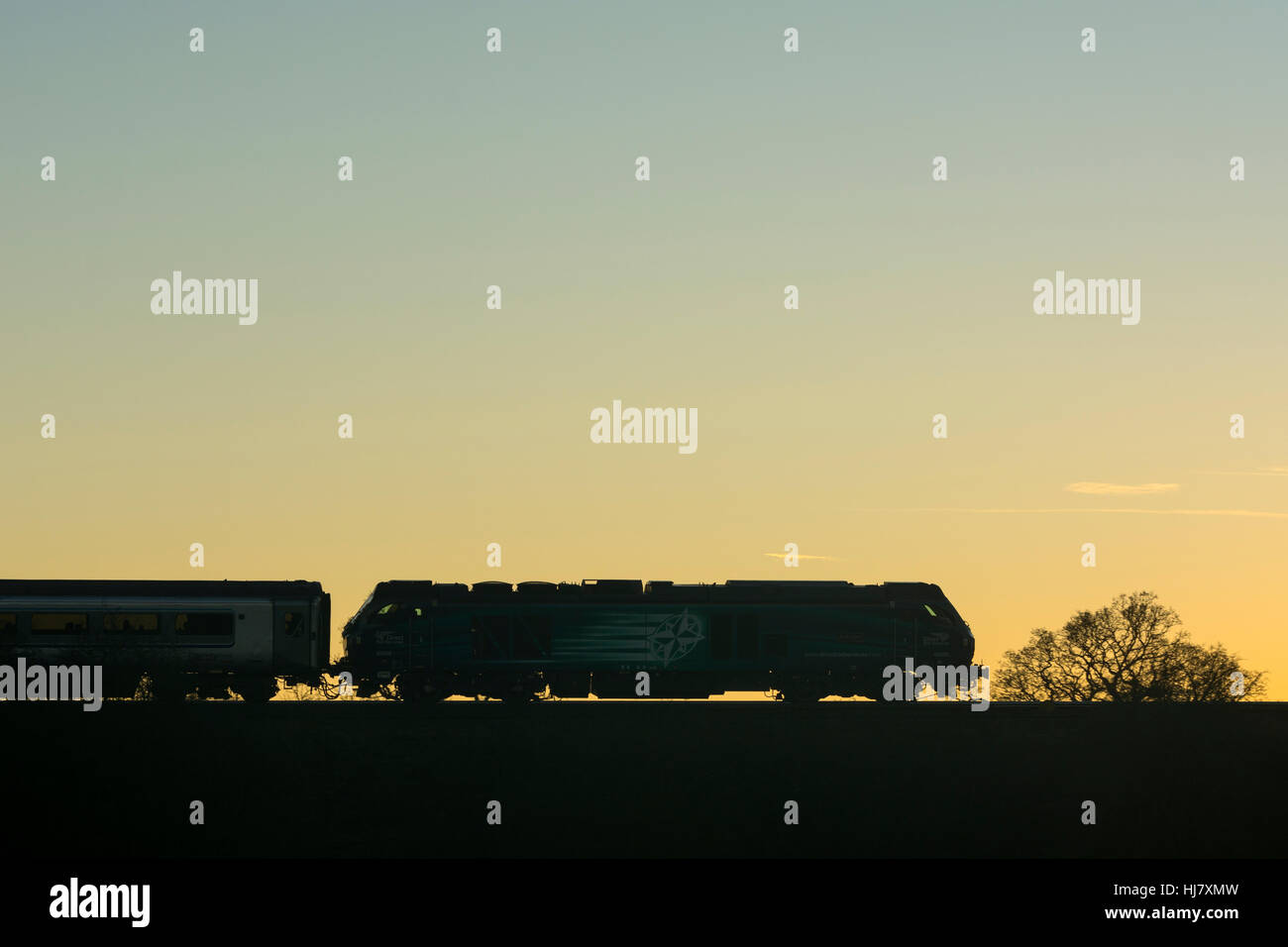 Class 68 diesel pulling a Chiltern Railways train at sunset ...