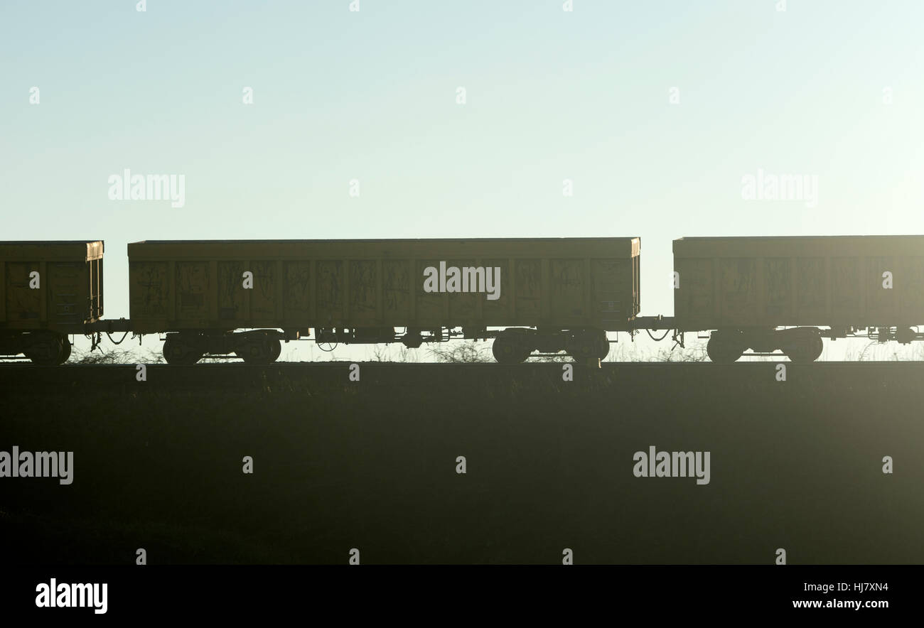 Trucks on a freight train, side view silhouette, Warwickshire, UK Stock ...