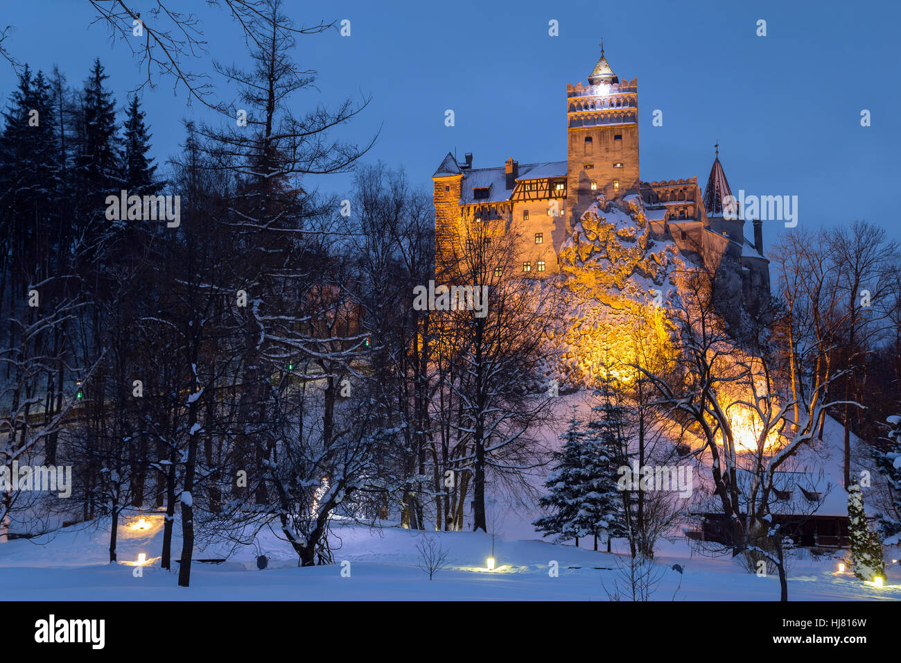 Winter view of Bran castle, also known as Dracula's castle, at blue ...