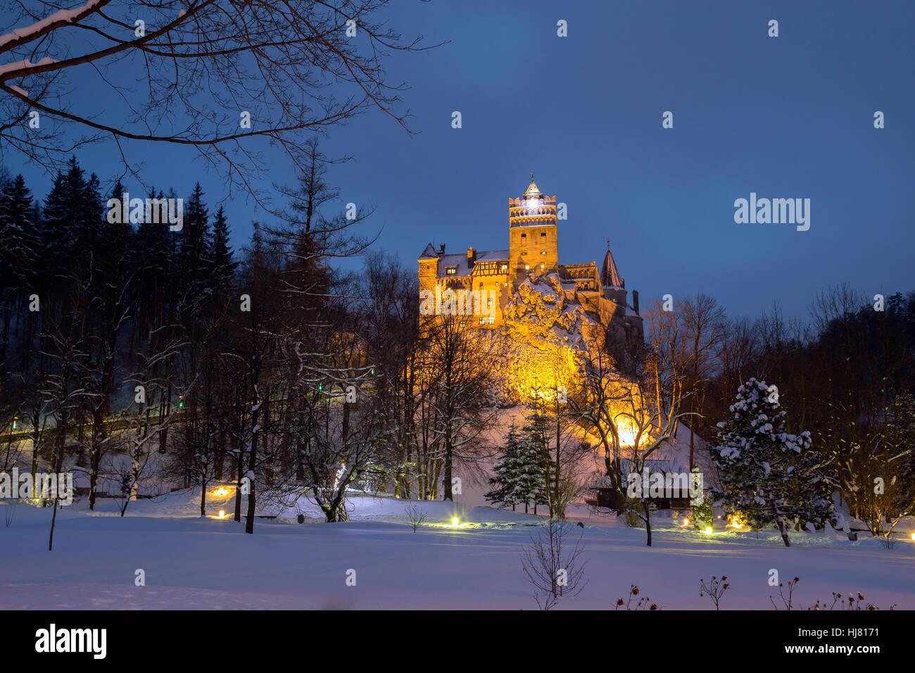 Winter view of Bran castle, also known as Dracula's castle, at blue ...