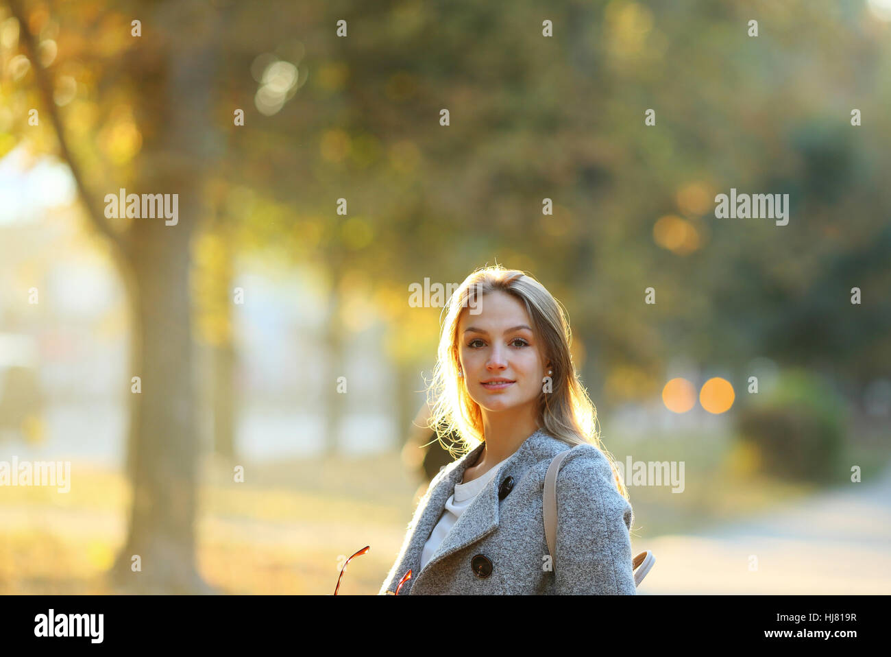 Beautiful girl looking right on sunlight Stock Photo - Alamy