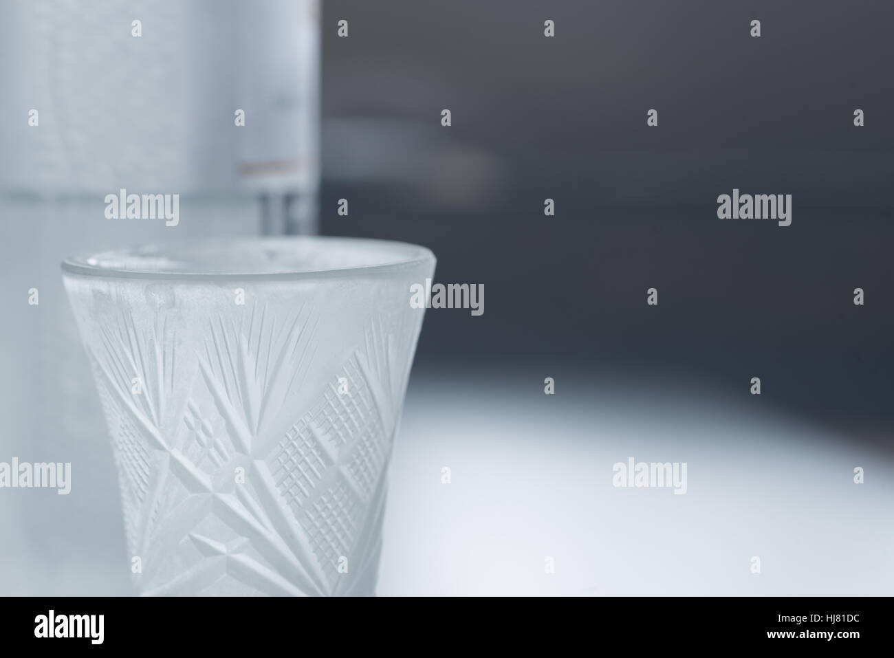 glass of vodka on table Stock Photo - Alamy