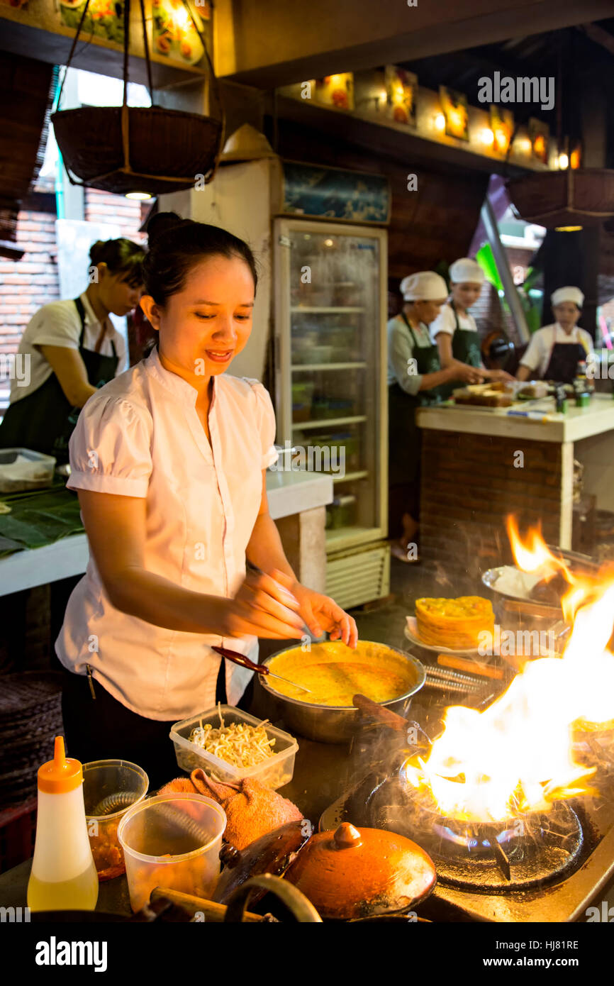 Woman doing cooking demonstration, Miss Vy's Cooking Academy, Market ...