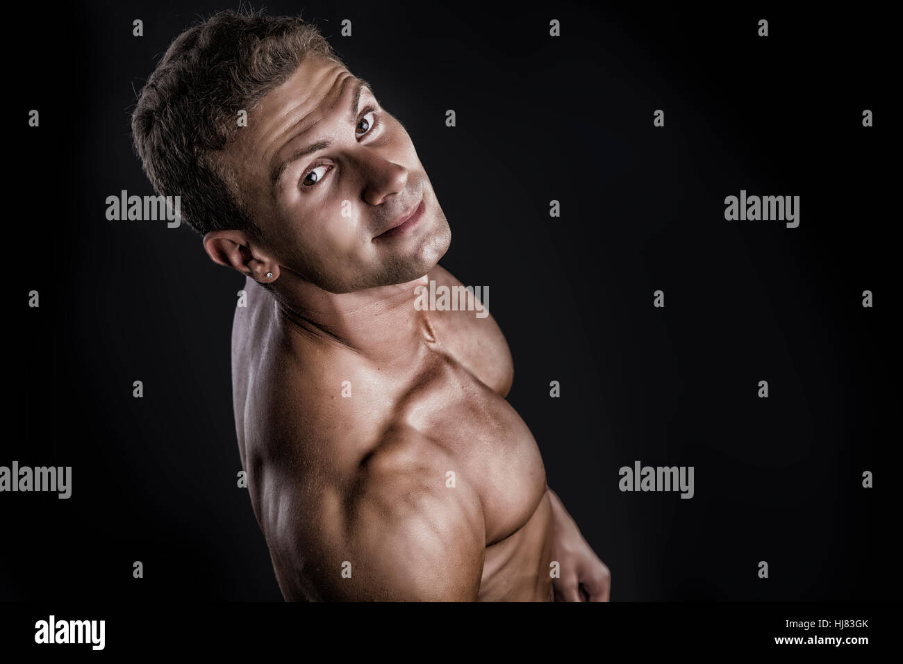 Handsome shirtless bodybuilder shot from above Stock Photo - Alamy