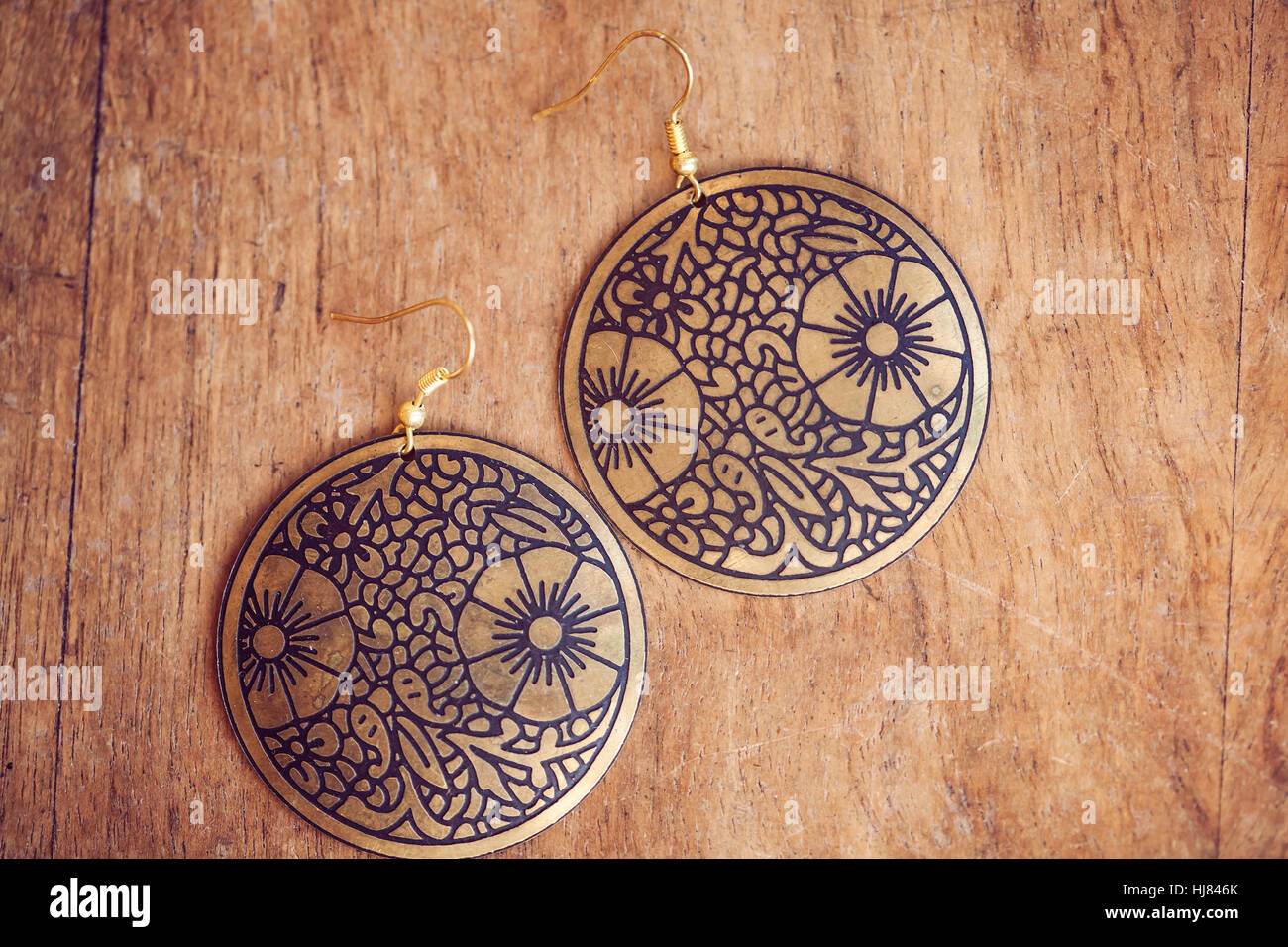 Beautiful female jewelry on wooden table Stock Photo - Alamy