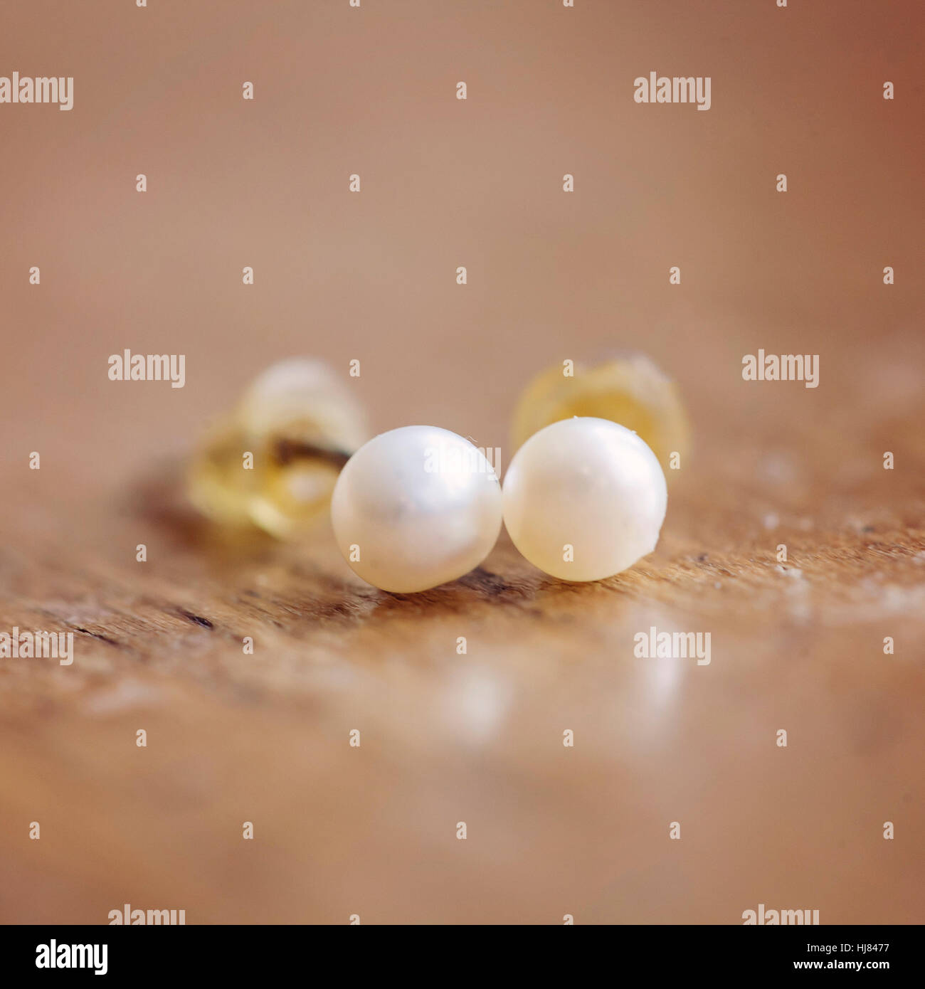 Beautiful female jewelry on wooden table Stock Photo - Alamy