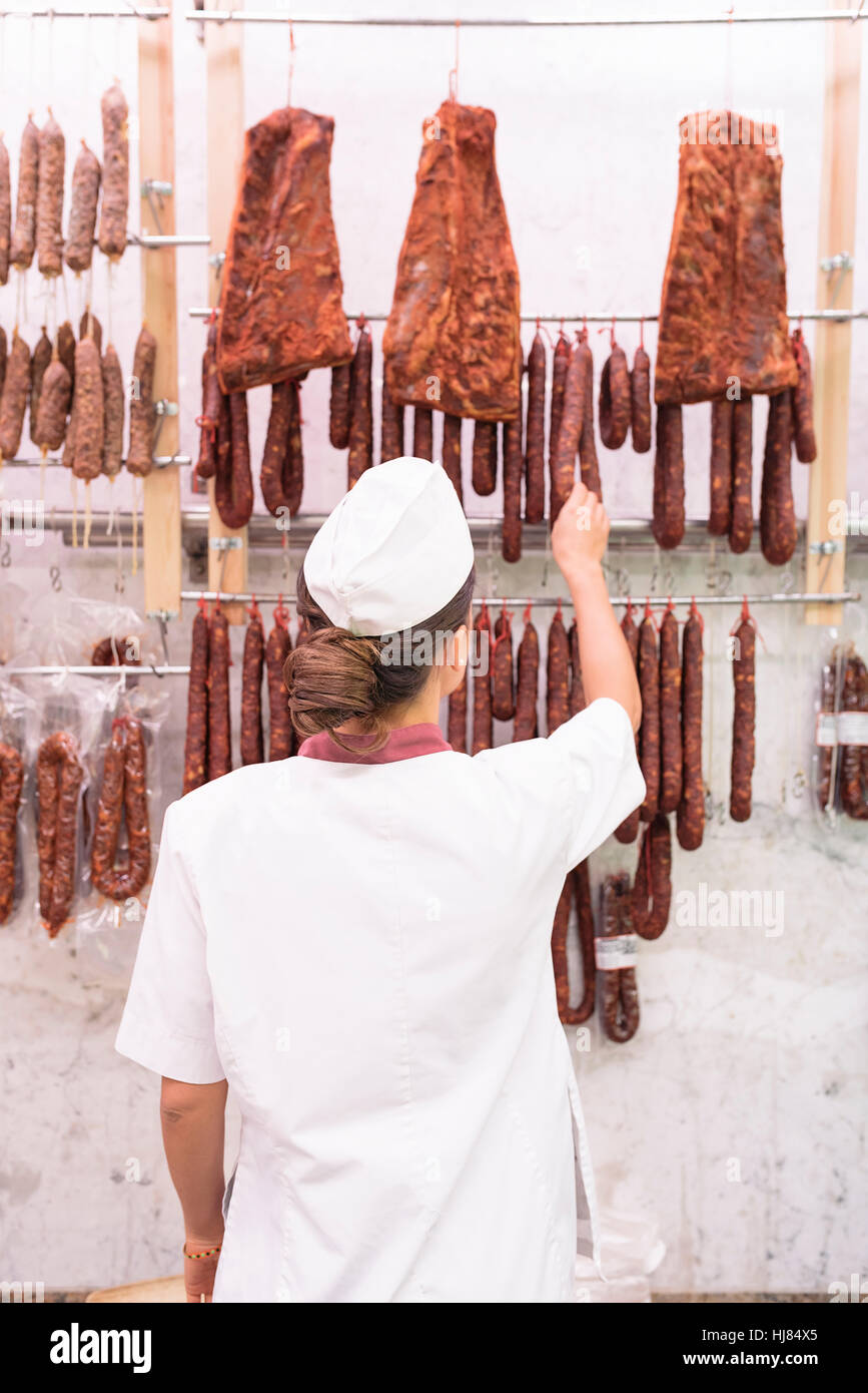 Pretty Butchery Woman working in butchery shop Stock Photo - Alamy