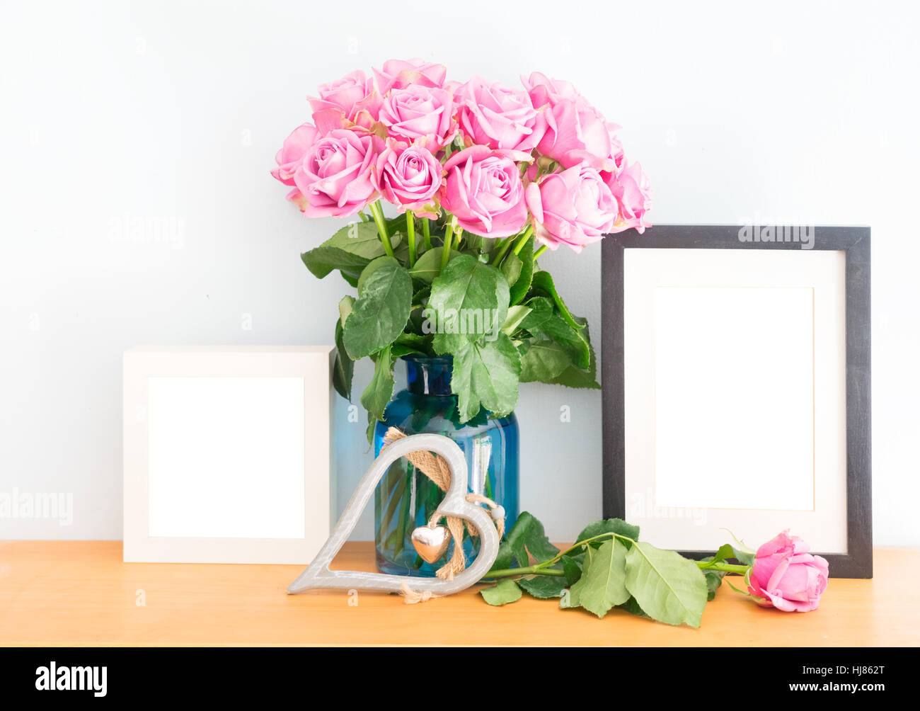 Violet roses with photo frame Stock Photo - Alamy