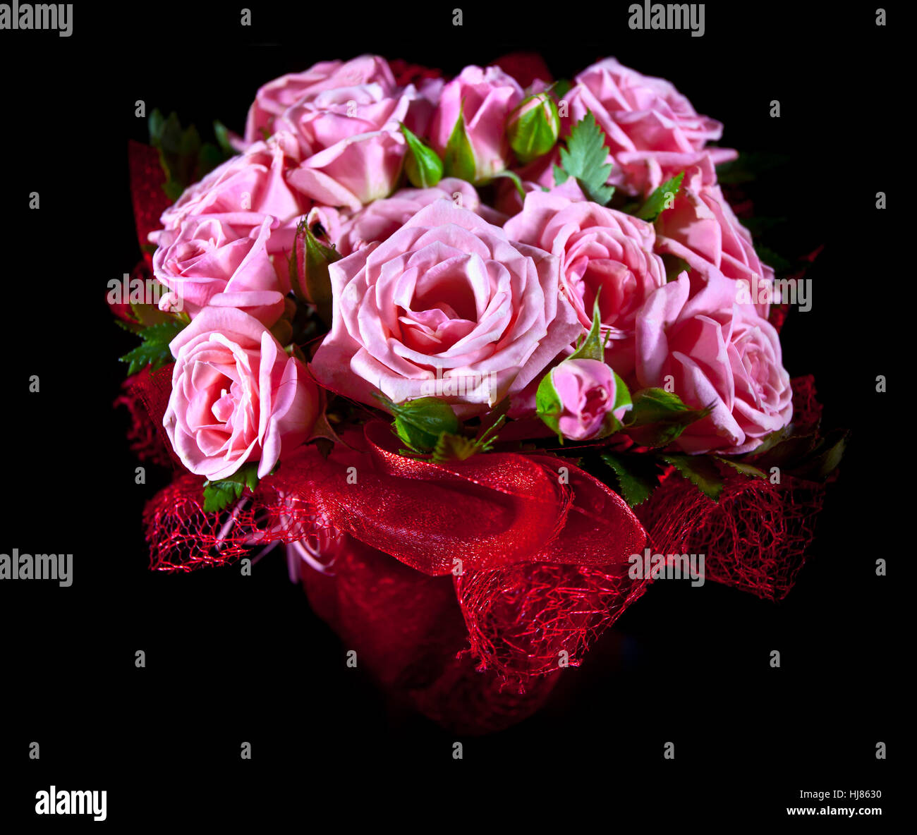 Bright roses bouquet isolated on black Stock Photo - Alamy