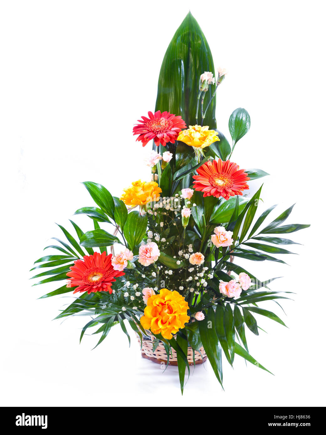 Bright flower bouquet in basket isolated over white background Stock ...