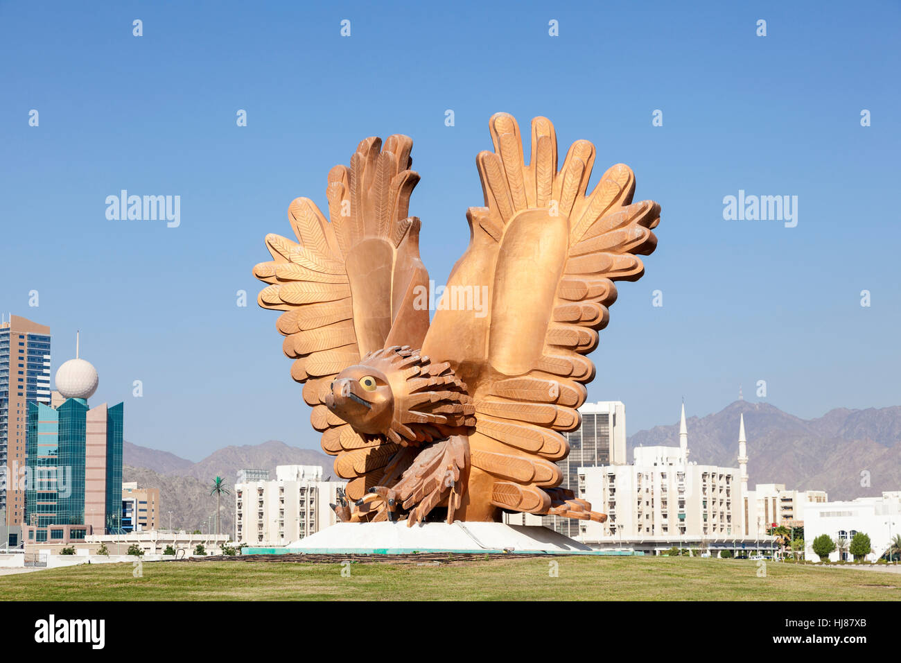 Statue of a golden falcon in the city of Fujairah, UAE Stock Photo - Alamy