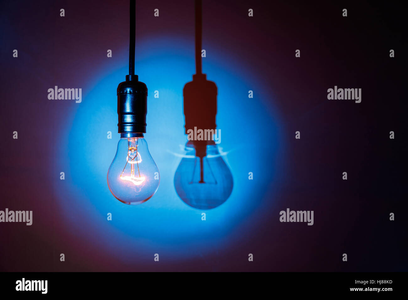 light bulb on blue background Stock Photo - Alamy