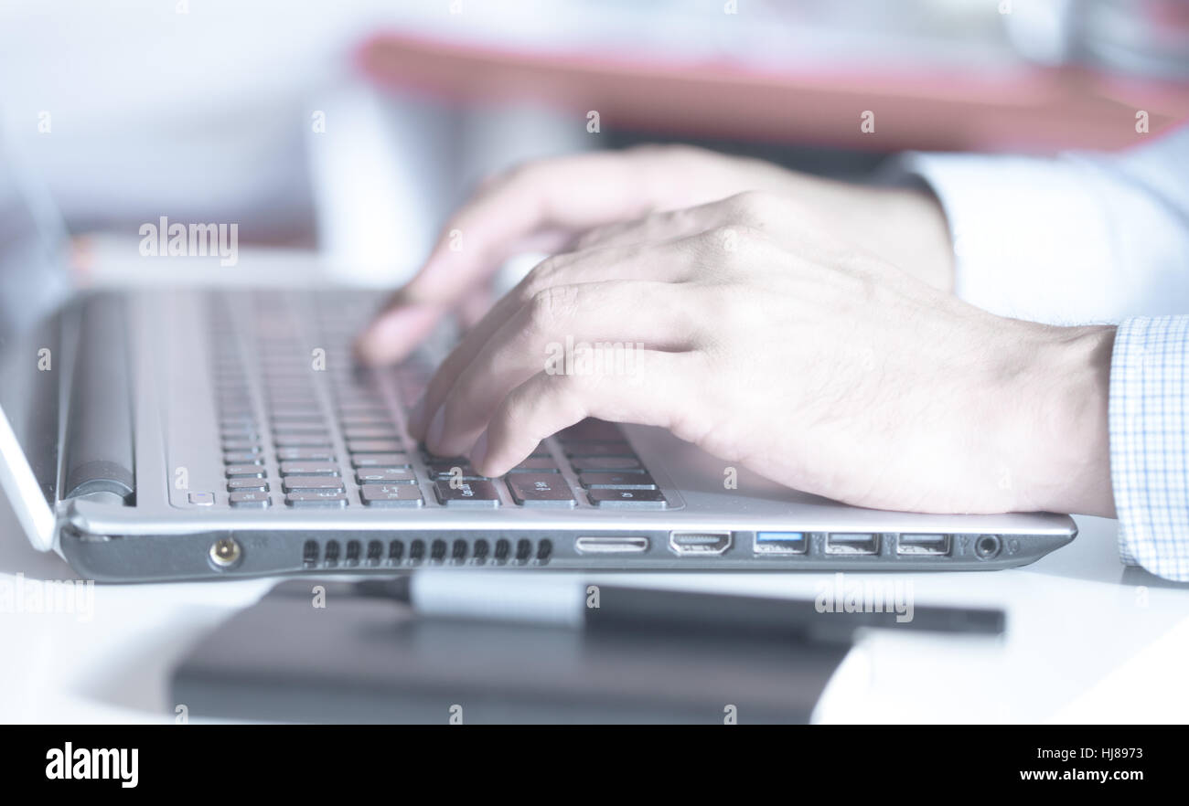 Working at home with laptop man Stock Photo - Alamy