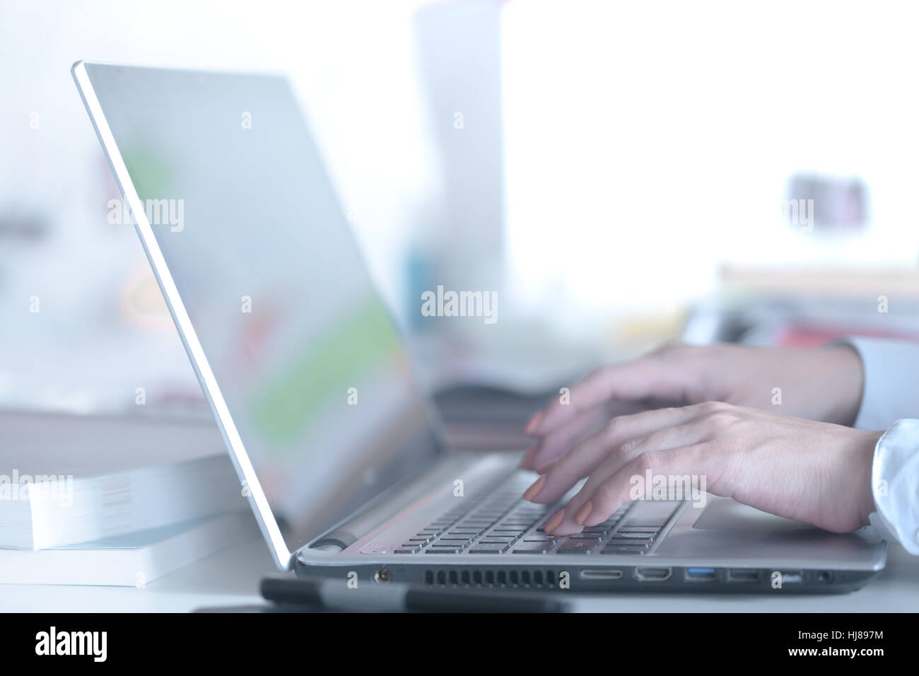 Female typing on laptop hi-res stock photography and images - Alamy