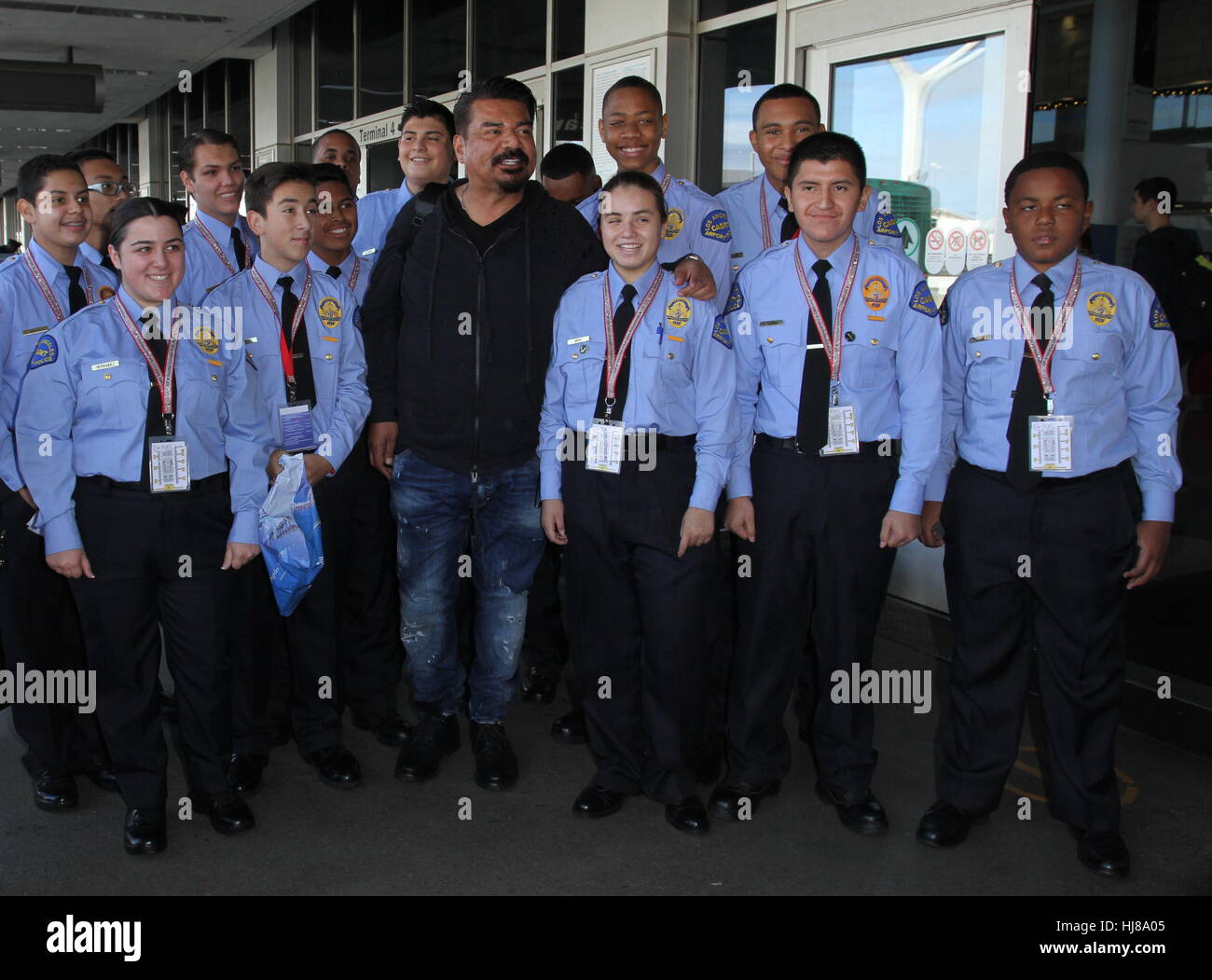 George Lopez departs from the airport and poses with the Los Angeles ...