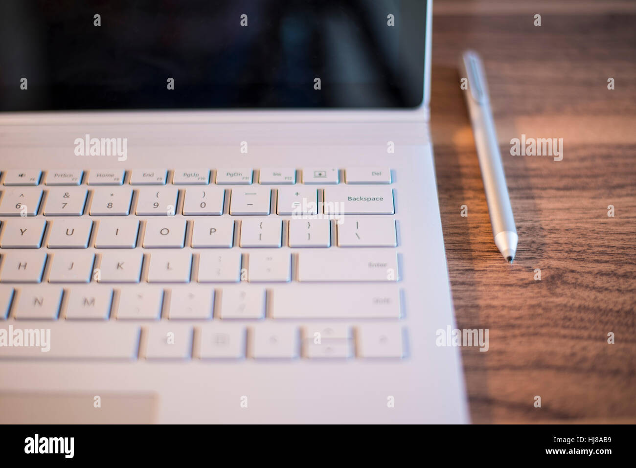 Laptop computer on a wood desk Stock Photo - Alamy